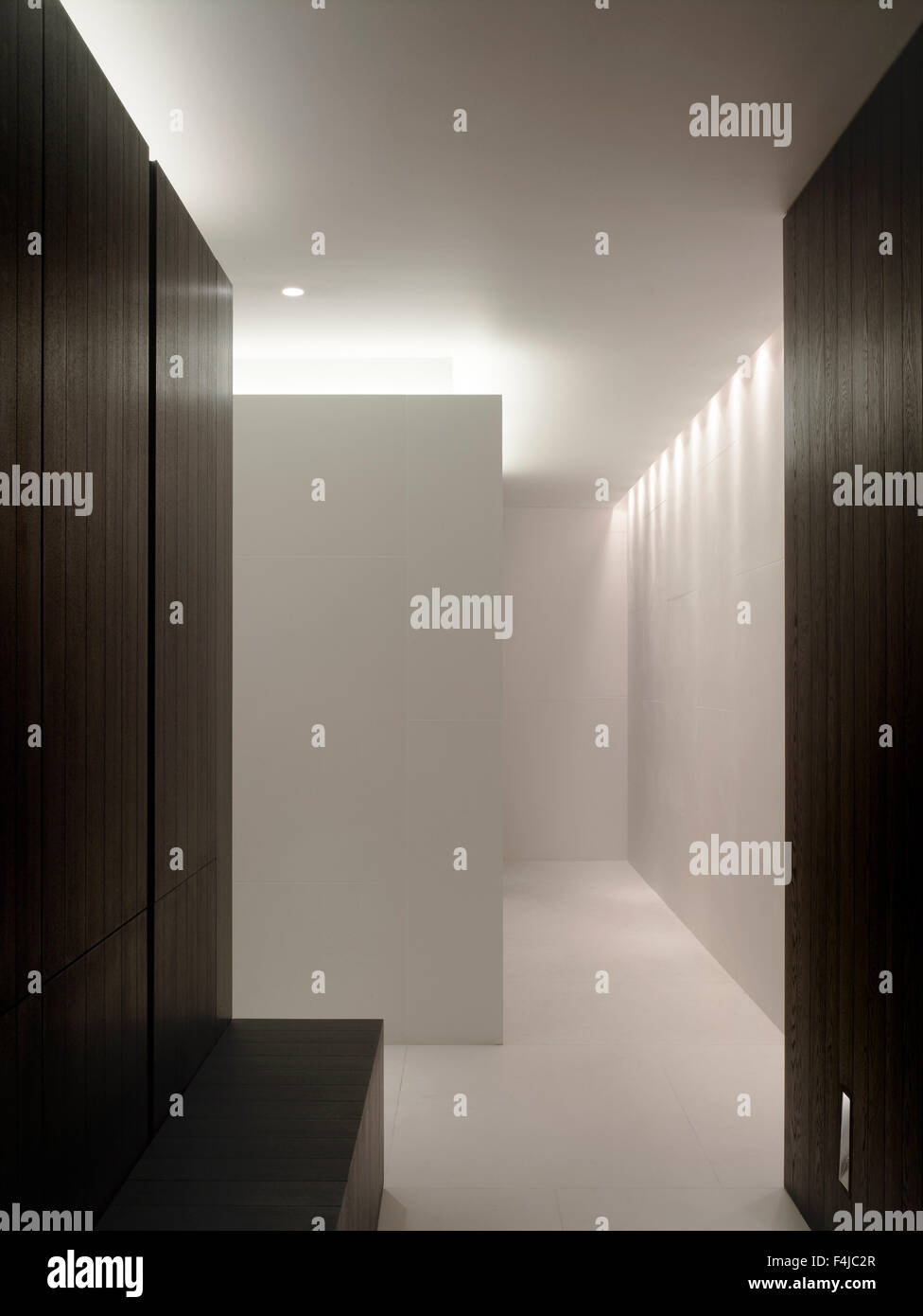 Corridor with inserted lighting and timber partition. Underground Spa ...