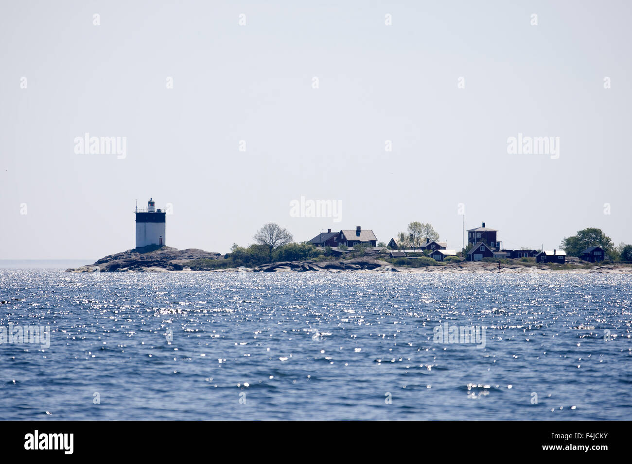 Scandinavian Peninsula, Sweden, Uppland, View of island with lighthouse ...