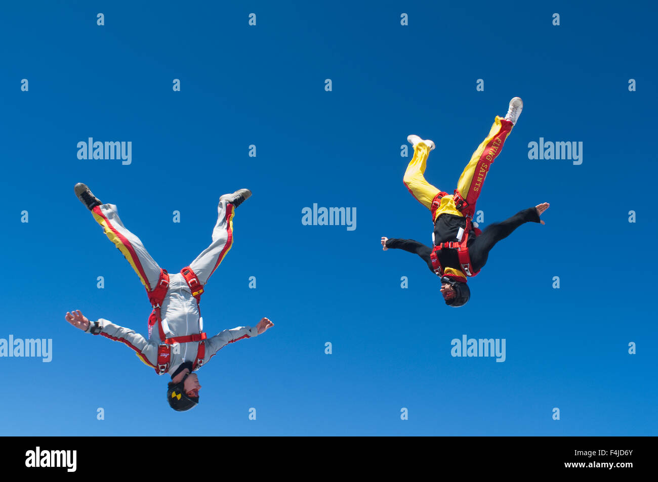 Scandinavia, Sweden, Uppland, Teenage couple jumping mid-air Stock ...