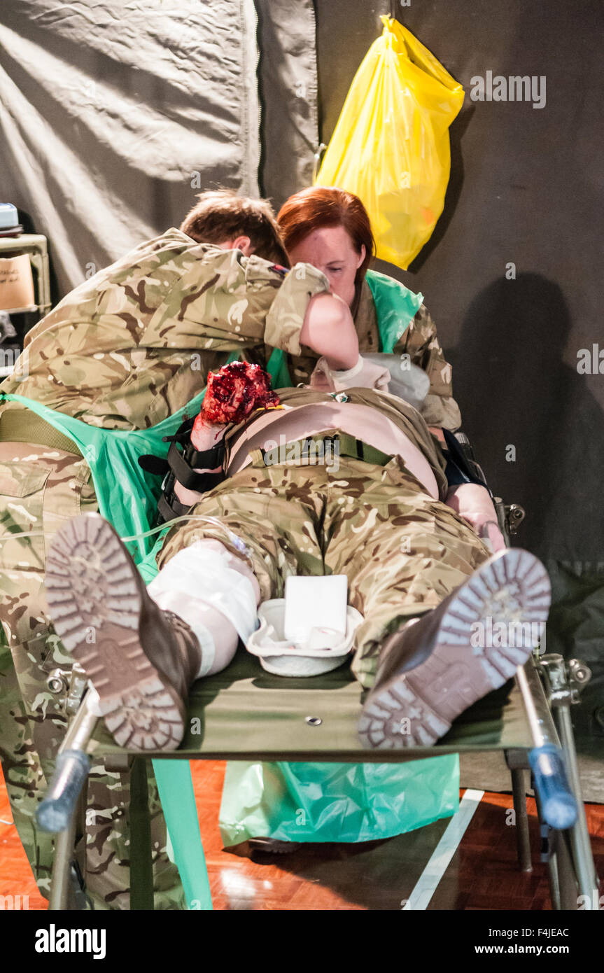 Nurses from the Royal Armoured Medical Corp (RAMC) attend to a soldier ...