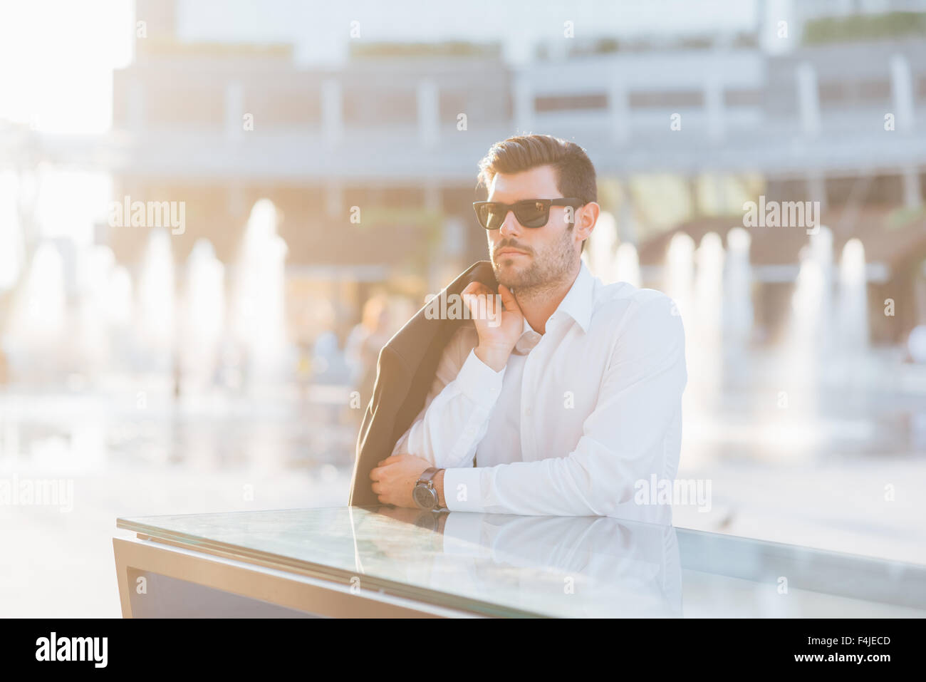 Handsome man leaning on counter hi-res stock photography and images - Alamy
