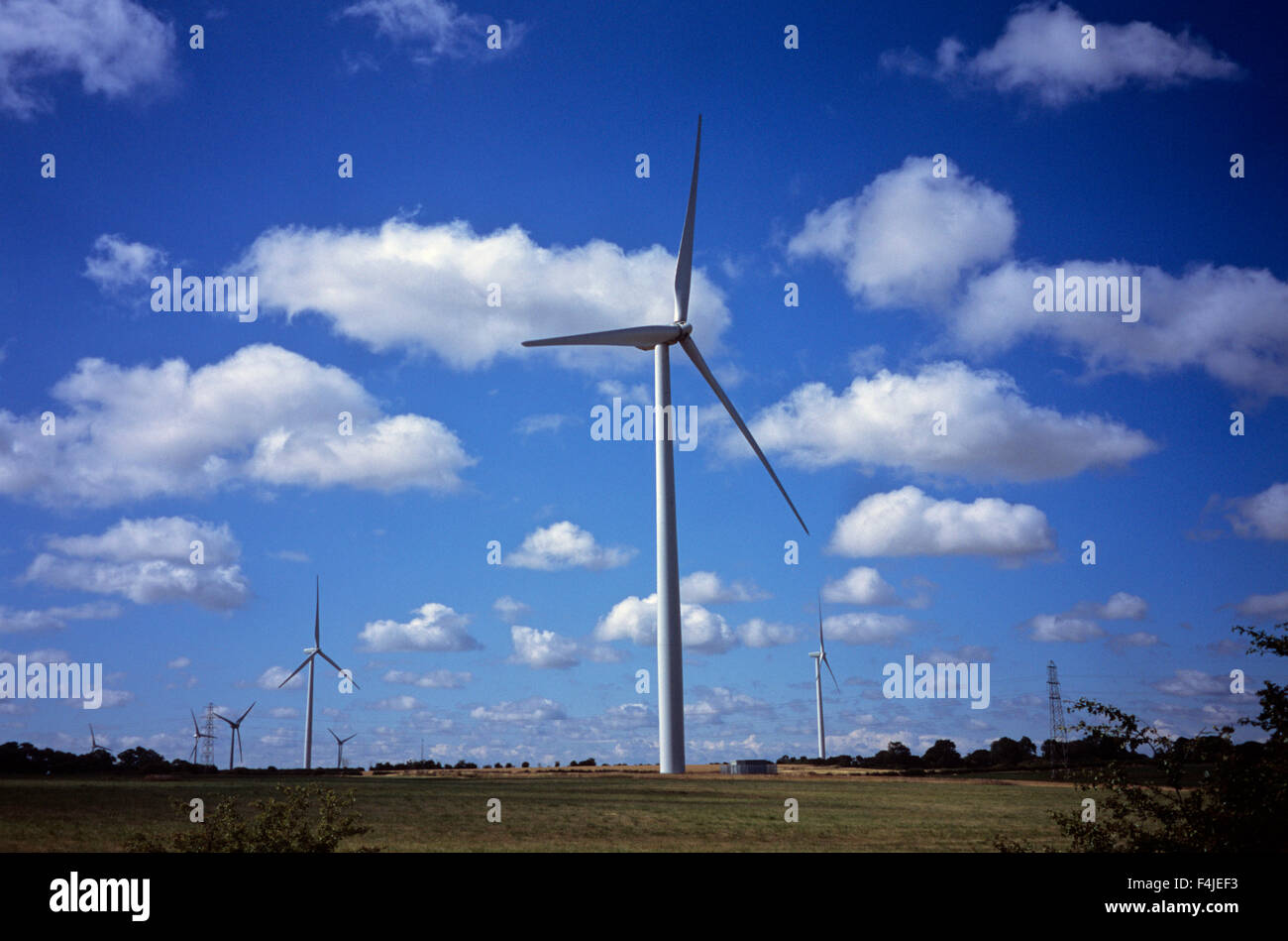 Wind farm uk blue sky cloud onshore on shore Stock Photo - Alamy