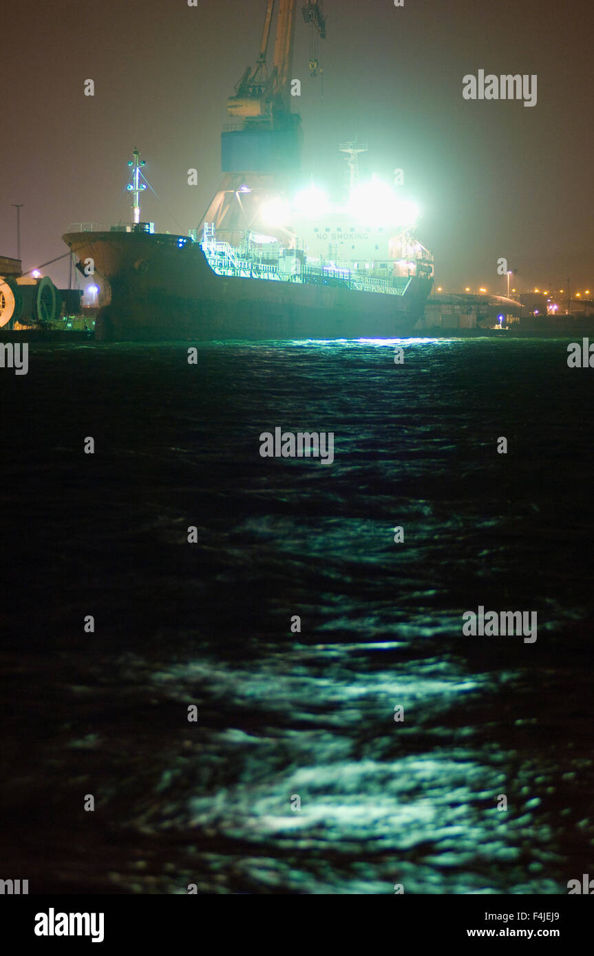 View of cargo ship at night Stock Photo - Alamy