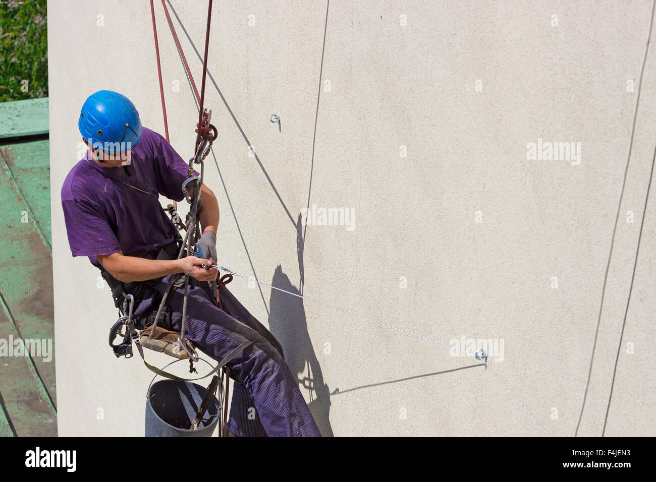 Man climbing out of window hi-res stock photography and images - Alamy