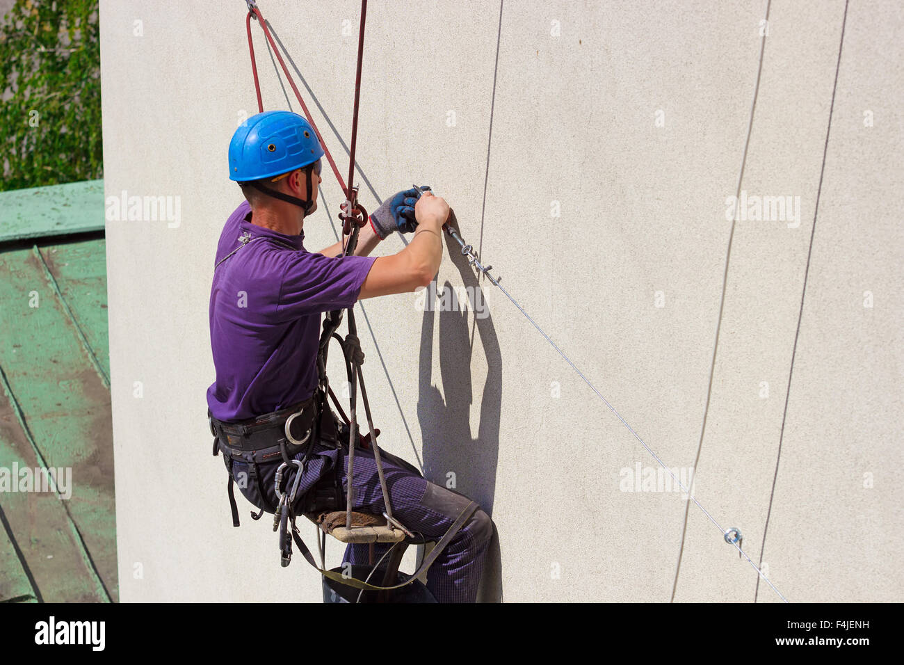 Man climbing out of window hi-res stock photography and images - Alamy