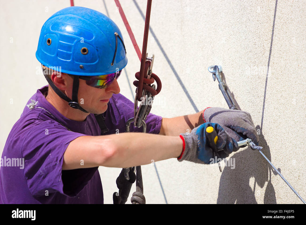 Man climbing out of window hi-res stock photography and images - Alamy