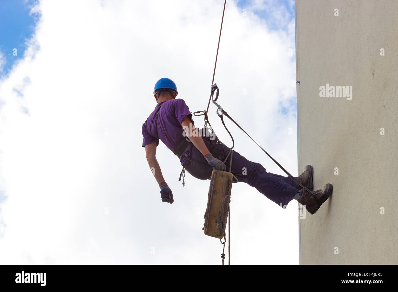 Man climbing out of window hi-res stock photography and images - Alamy