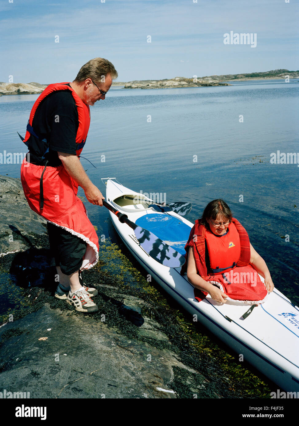Mature couple kayaking Stock Photo - Alamy