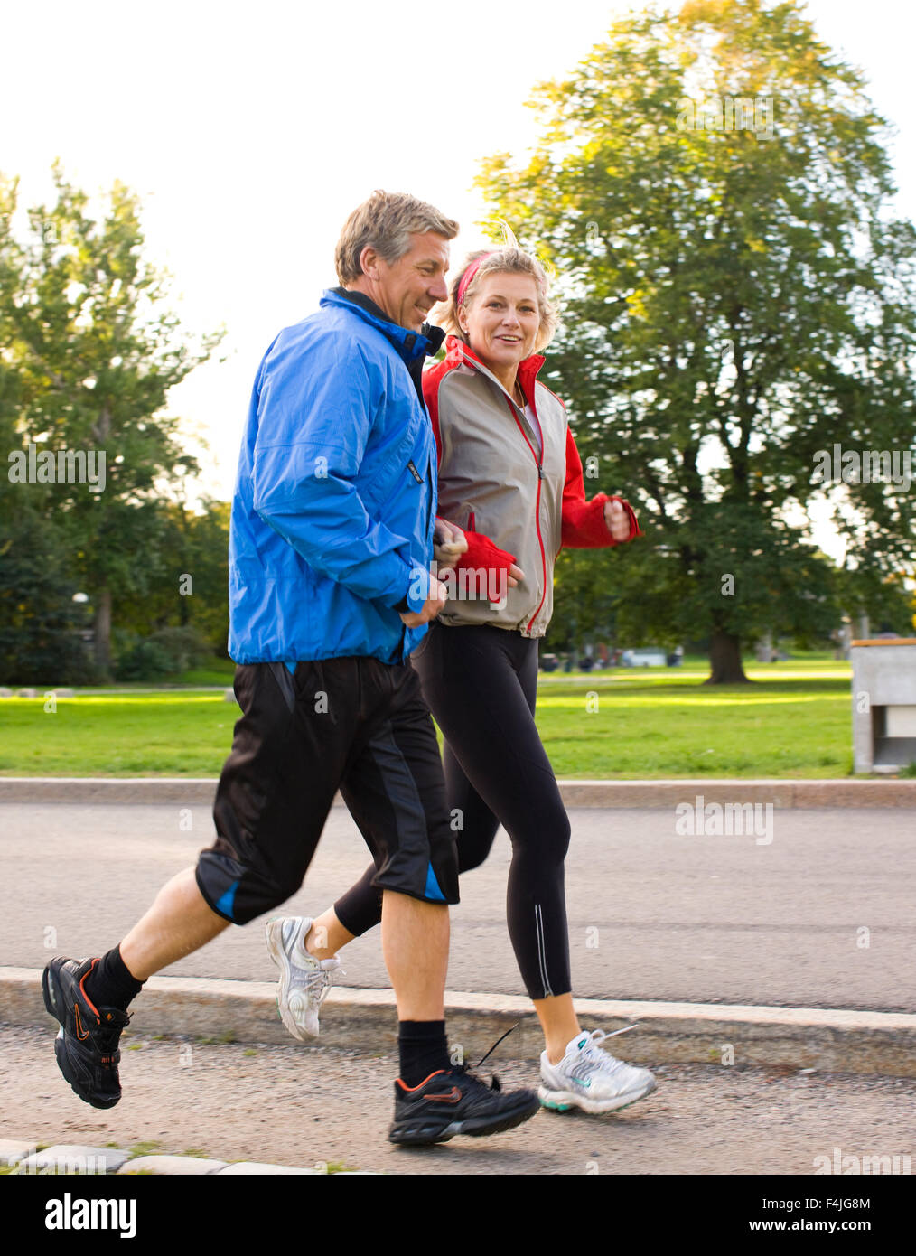 Couple jogging together Stock Photo - Alamy