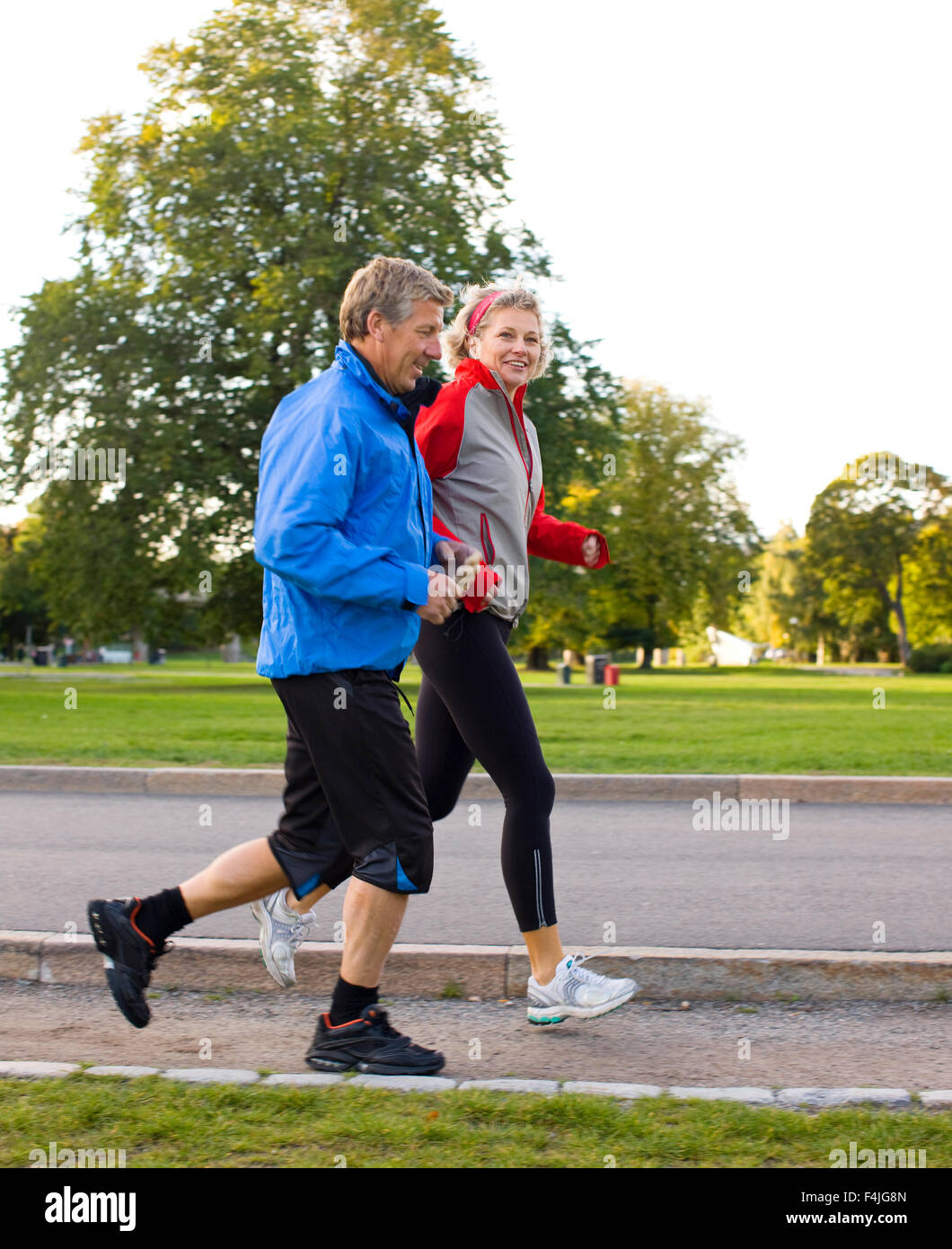 Couple jogging together Stock Photo - Alamy