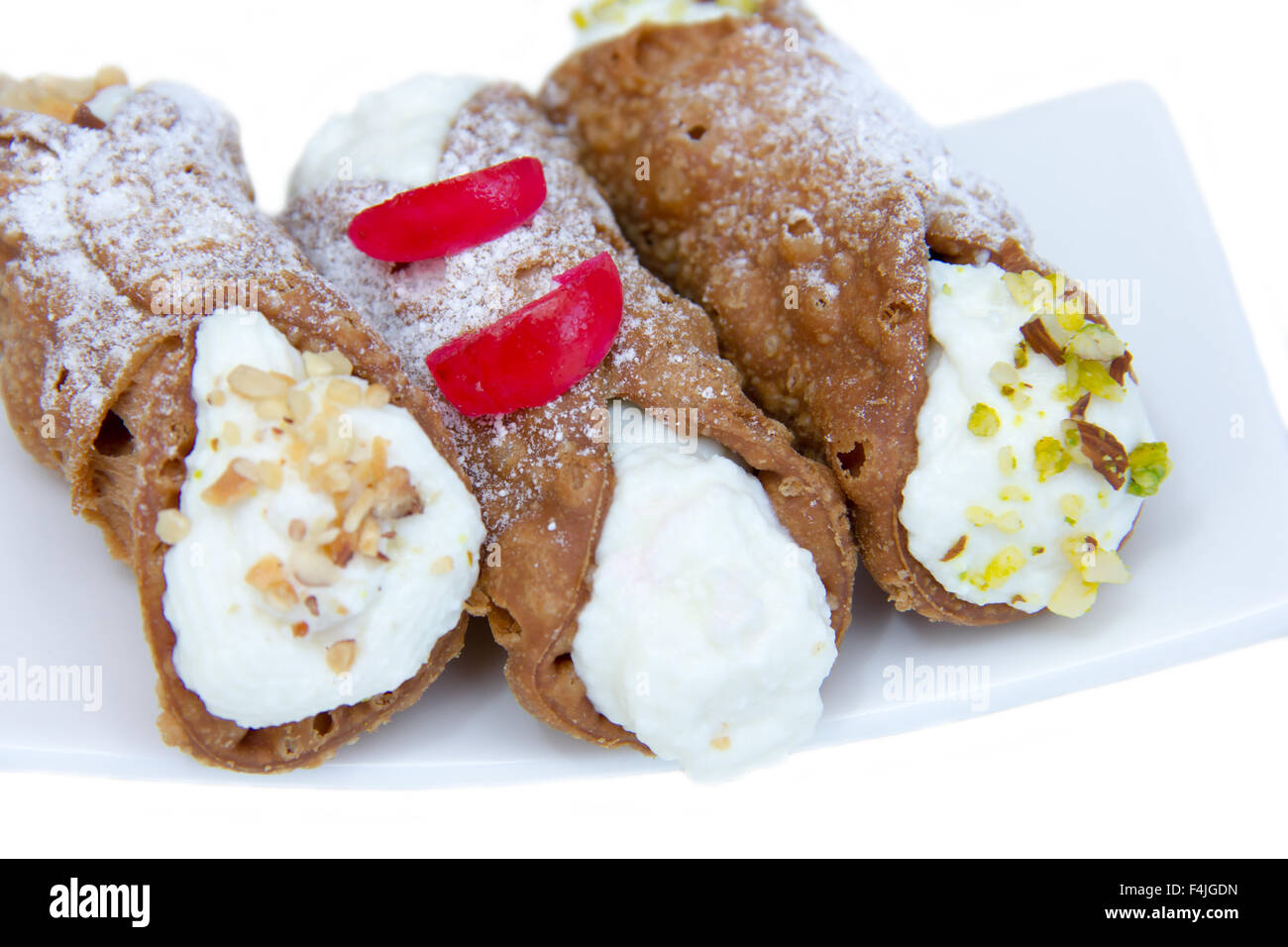 Cannoli with ricotta cheese on white background seen up close Stock ...