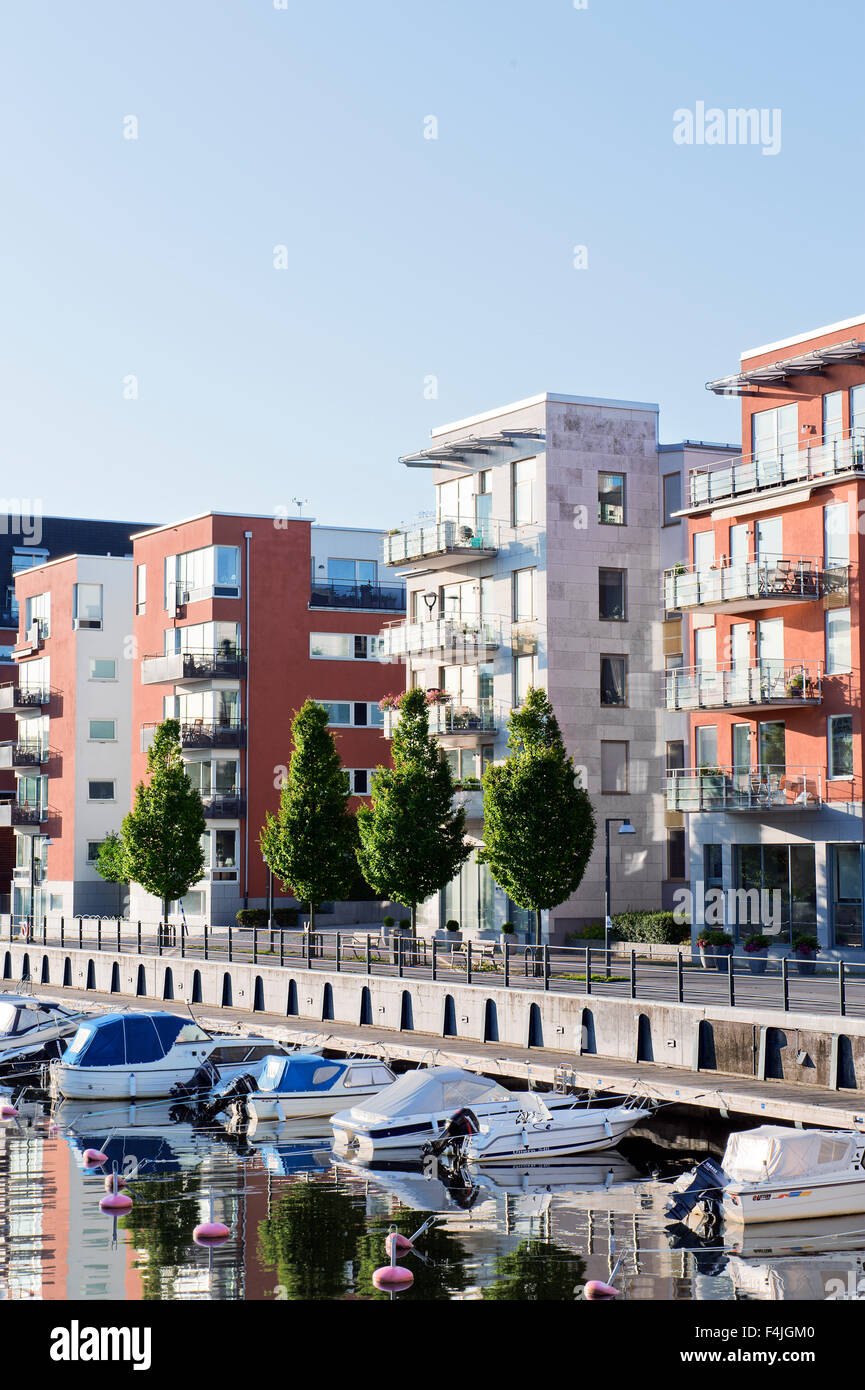 Buildings on waterfront with boats Stock Photo - Alamy