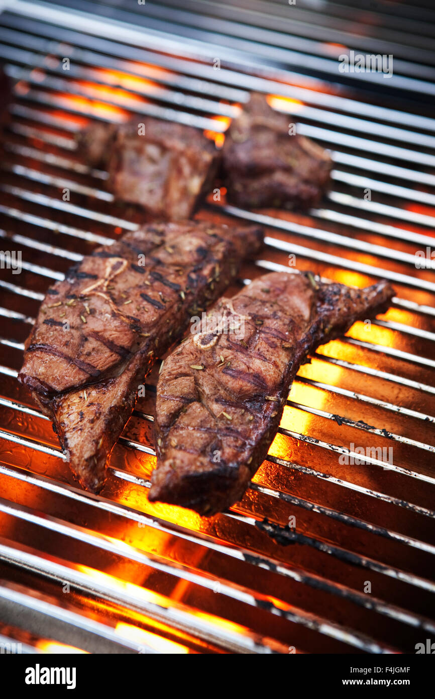 Meat cooked on barbecue grill Stock Photo - Alamy