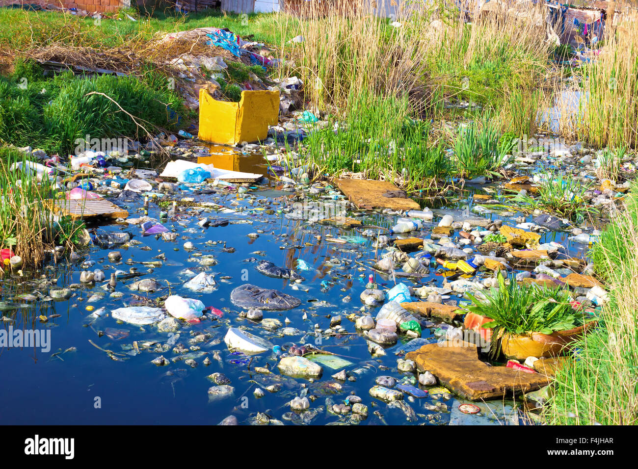 River that is polluted with various garbage and trash Stock Photo - Alamy