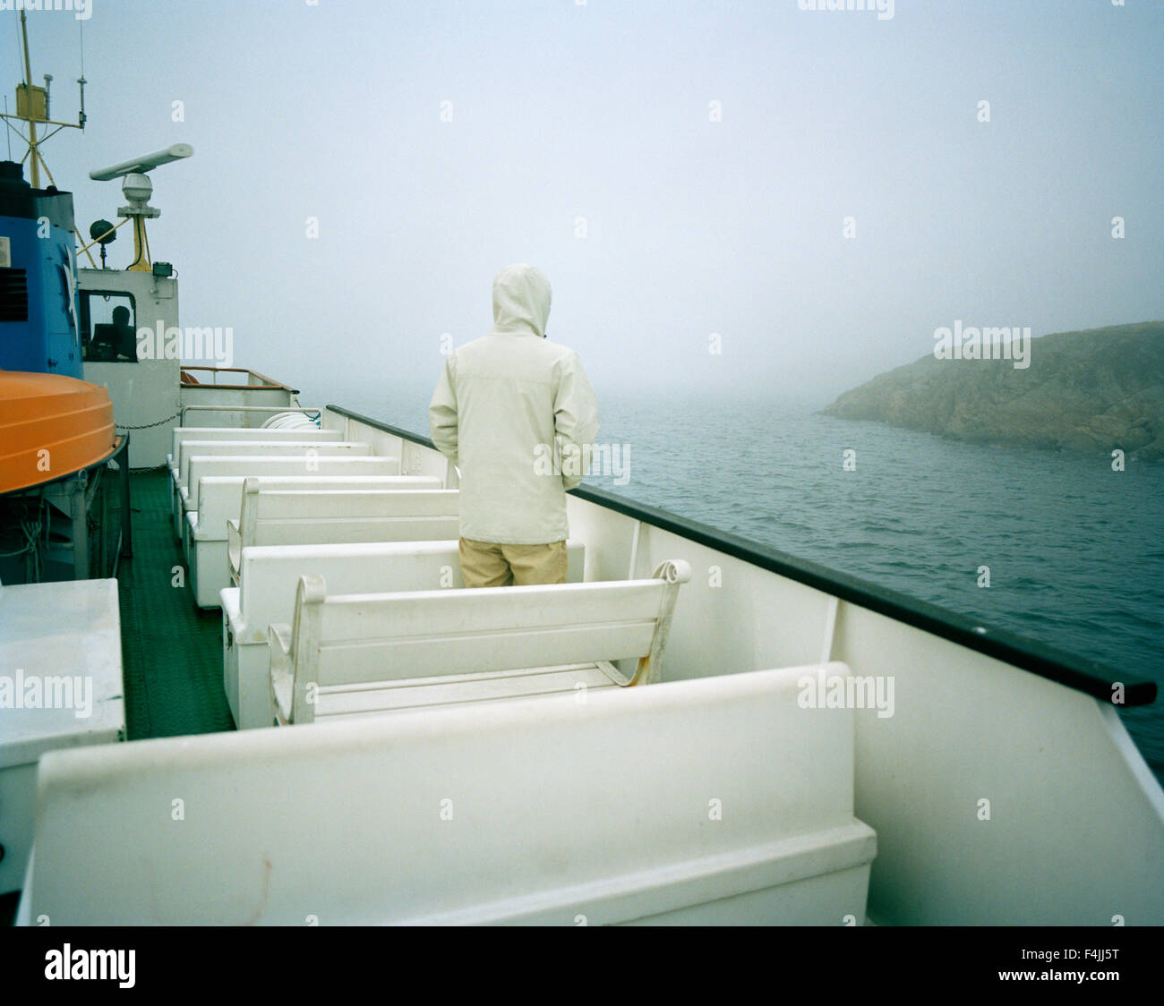 Lonely man on ferry Stock Photo - Alamy