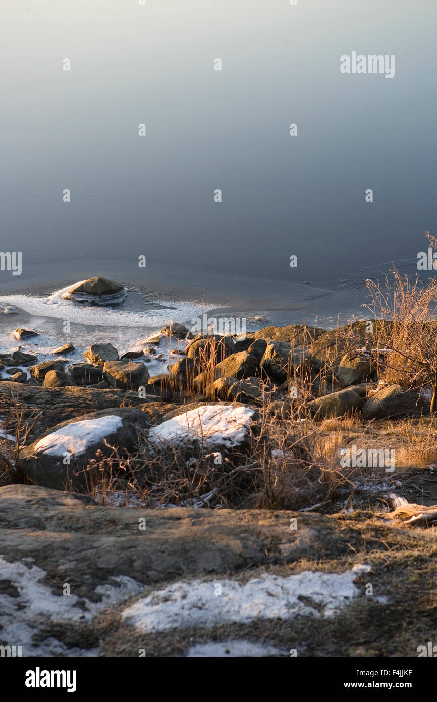 Frozen rocks by sea Stock Photo - Alamy