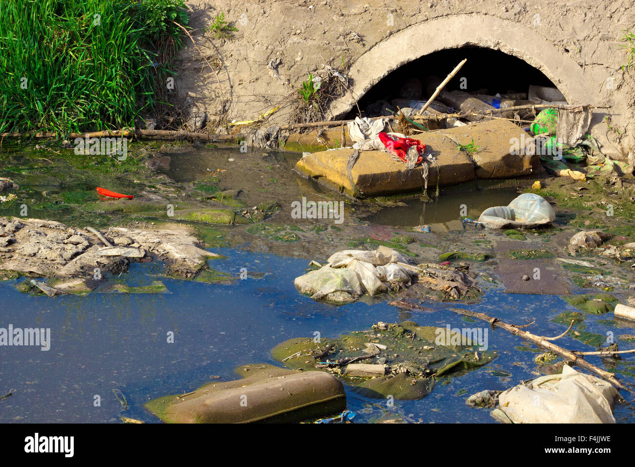 River that is polluted with various garbage and trash Stock Photo - Alamy