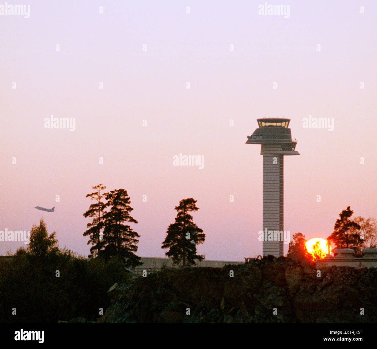Air traffic control tower at sunset Stock Photo - Alamy