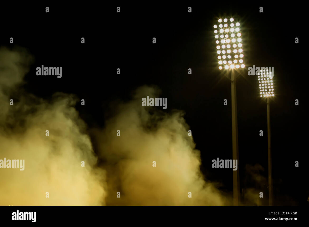 stadium lights and smoke Stock Photo - Alamy