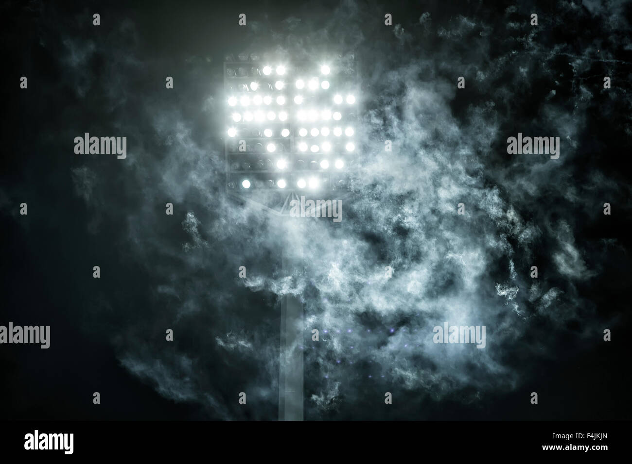 stadium lights and smoke Stock Photo - Alamy