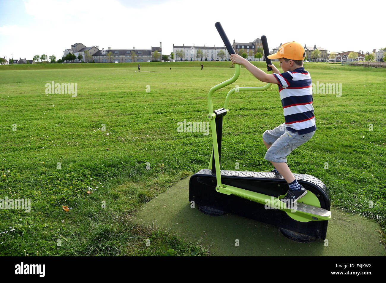 Boy plays in the Great Field at Poundbury village, Dorset, Britain, UK ...
