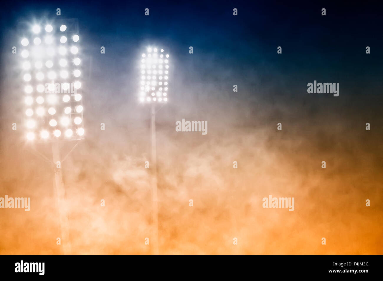 stadium lights and smoke Stock Photo - Alamy