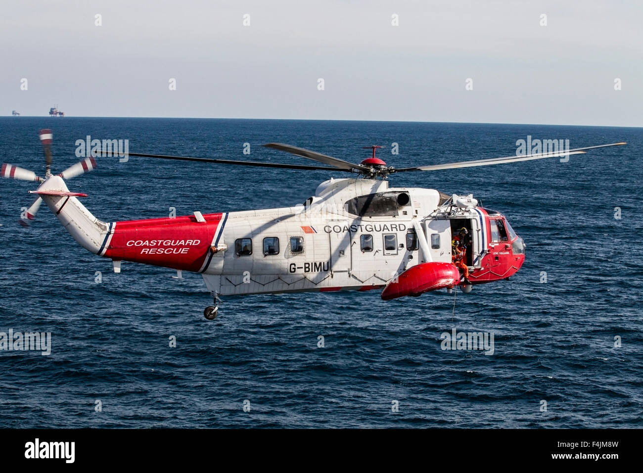 Coastguard helicopter flying over beach hi-res stock photography and ...