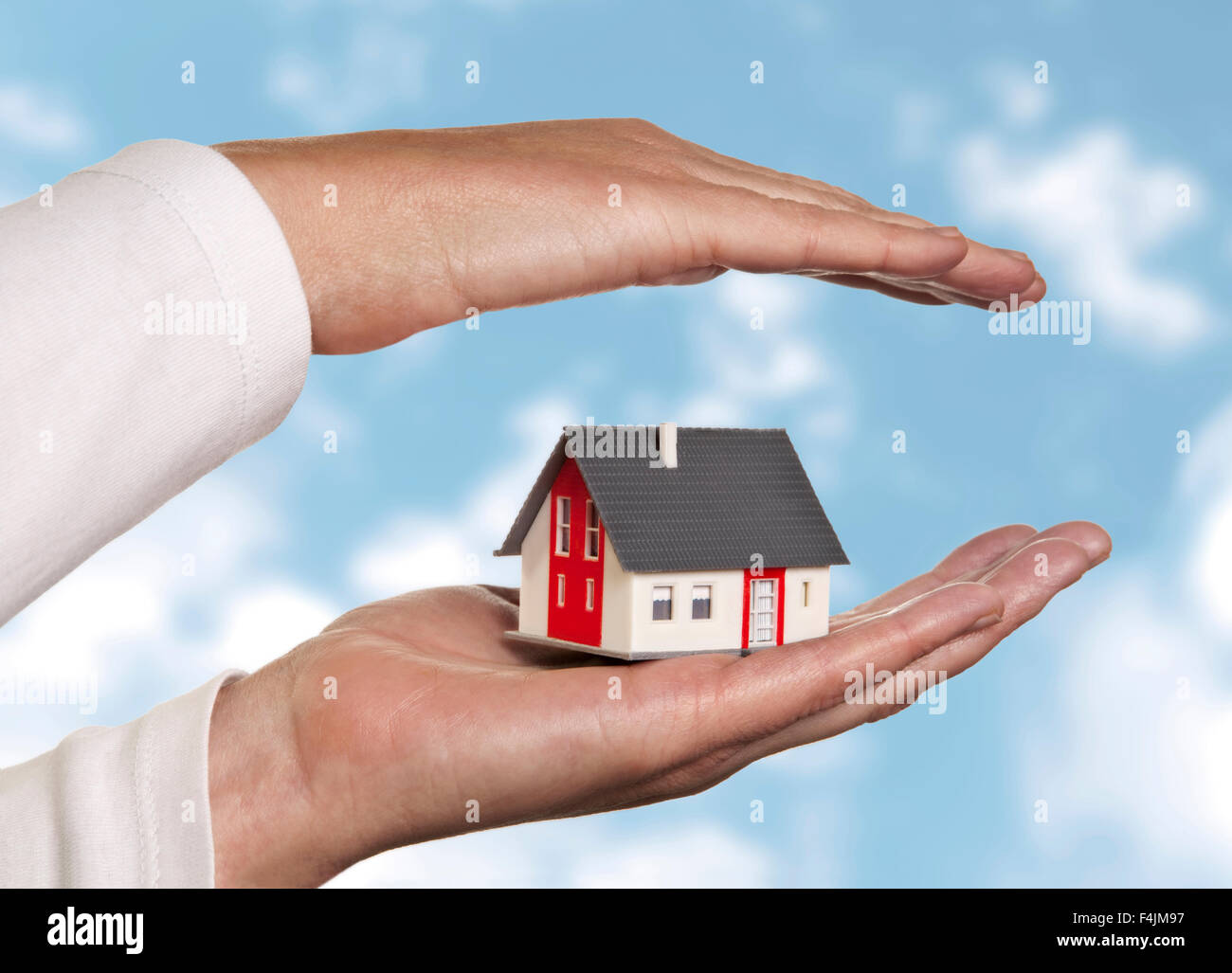 Hand protectively hi-res stock photography and images - Alamy