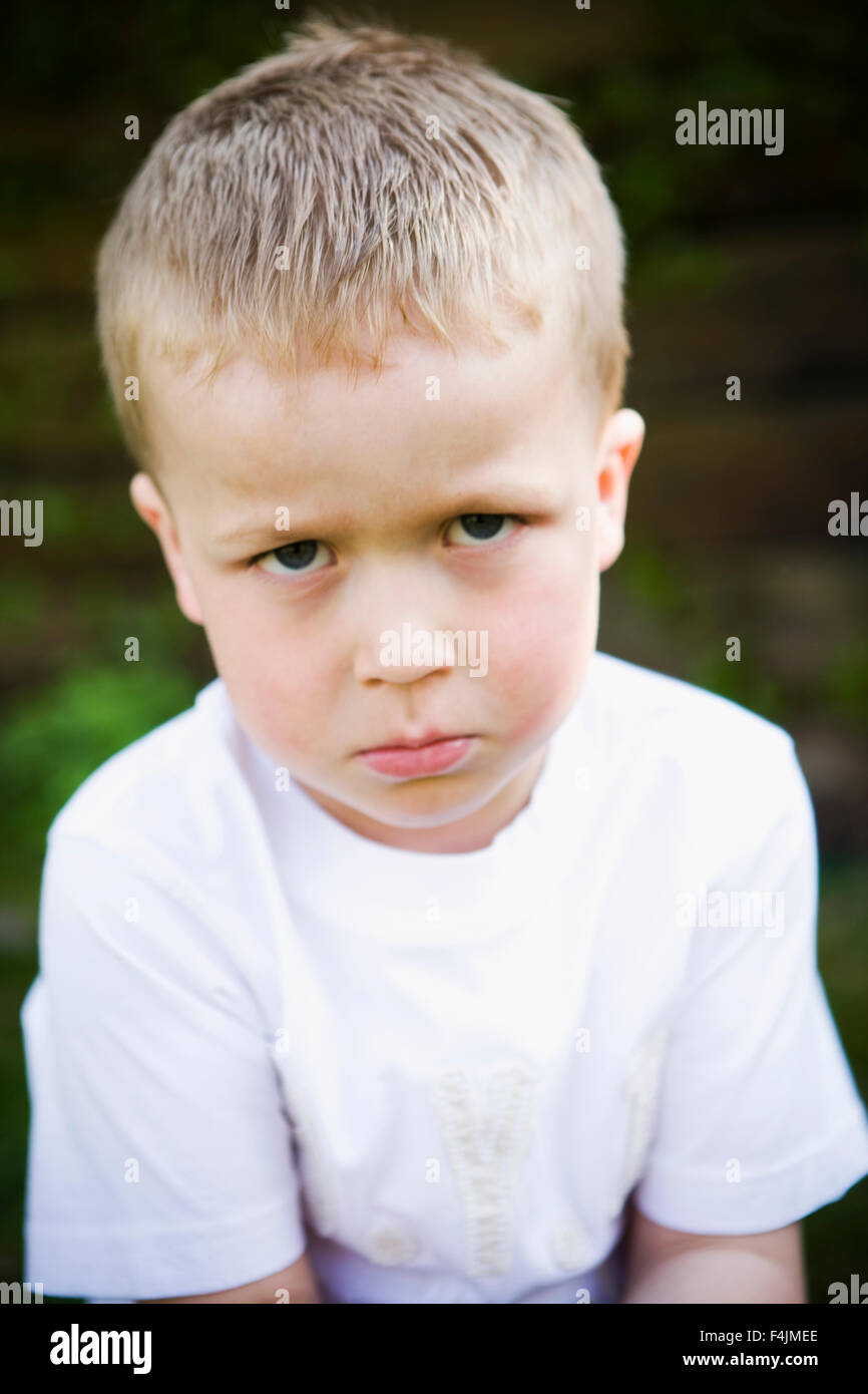 Sweden, Stockholm, portrait of grumpy boy (4-5 Stock Photo - Alamy