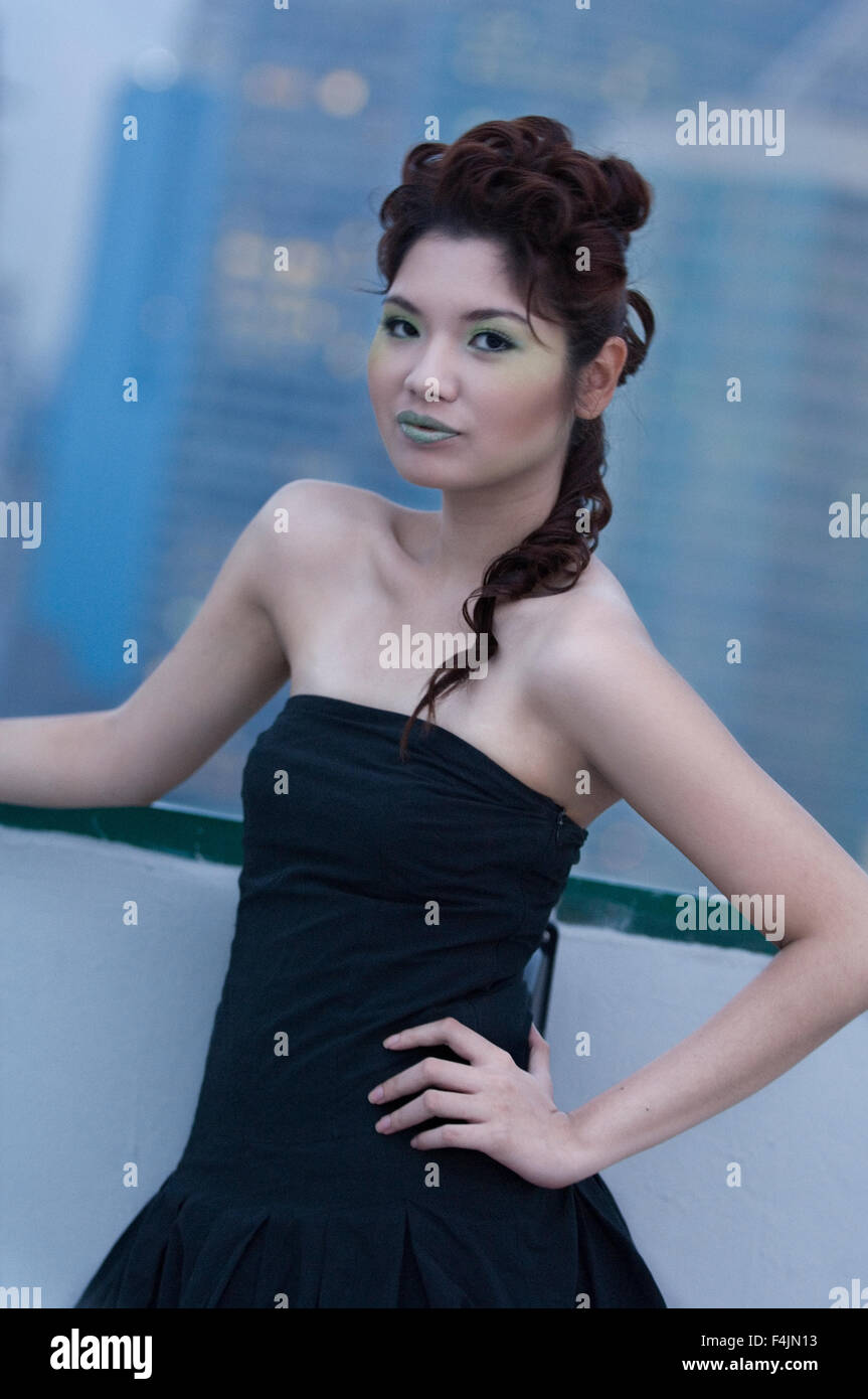 Philippines, portrait of woman wearing black dress Stock Photo - Alamy
