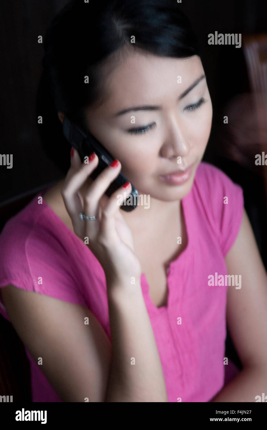 Philippines, woman using telephone Stock Photo - Alamy