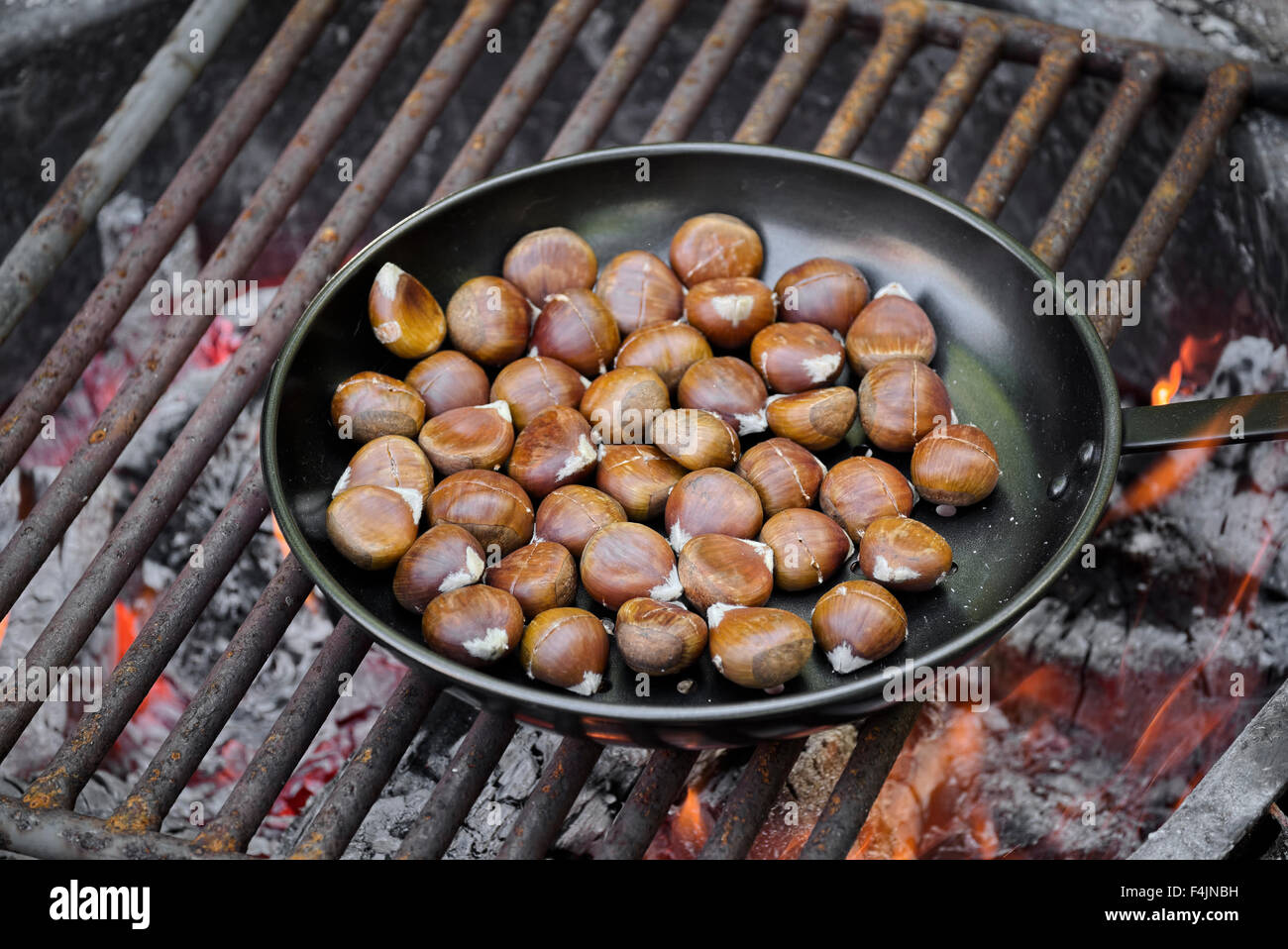 chestnuts roasting on an open fire Stock Photo - Alamy