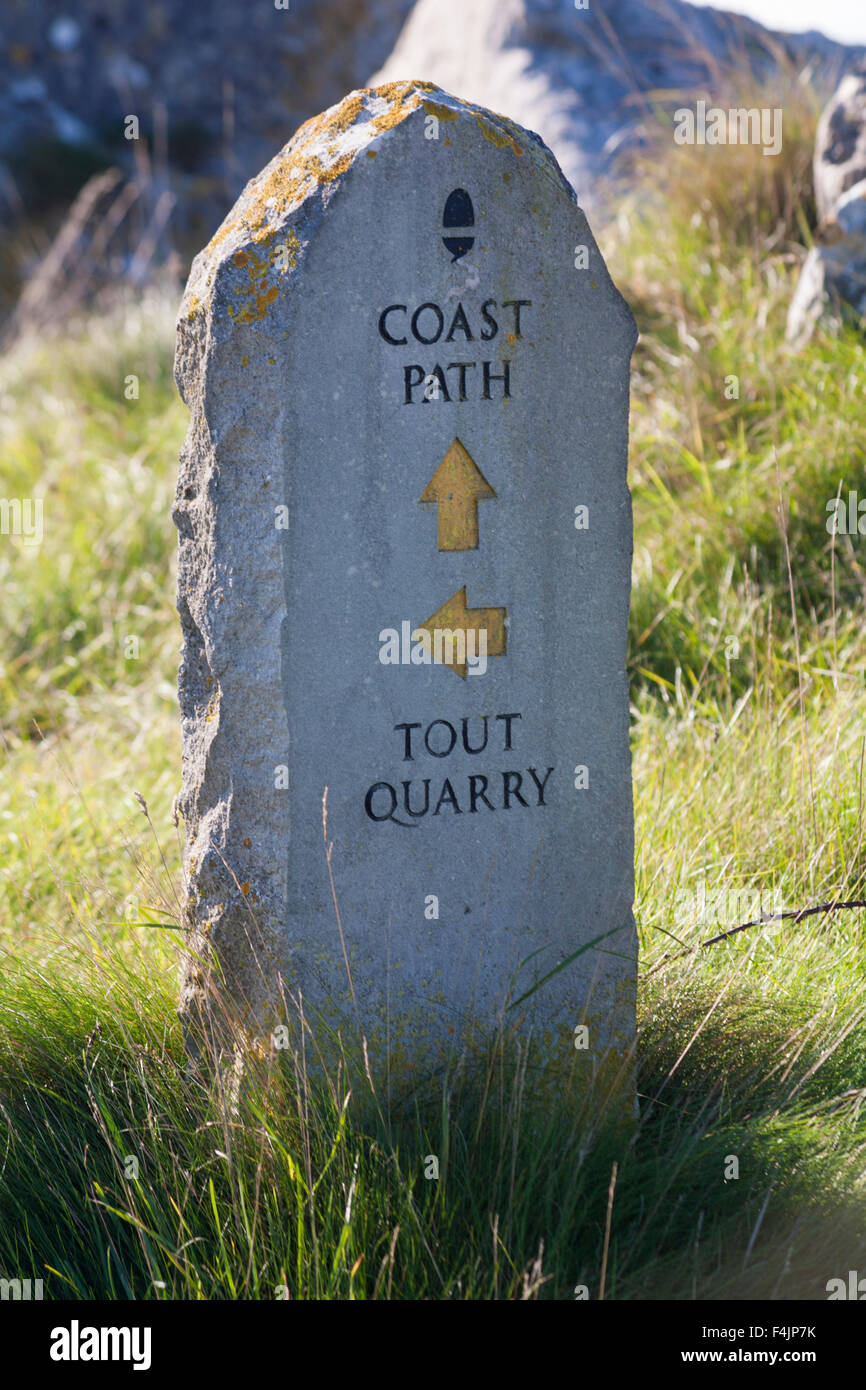 Waymarker sign showing directions to Coast Path and Tout Quarry at Tout ...