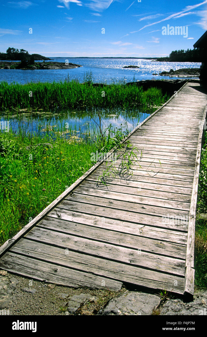 Wooden boardwalk near coast Stock Photo - Alamy