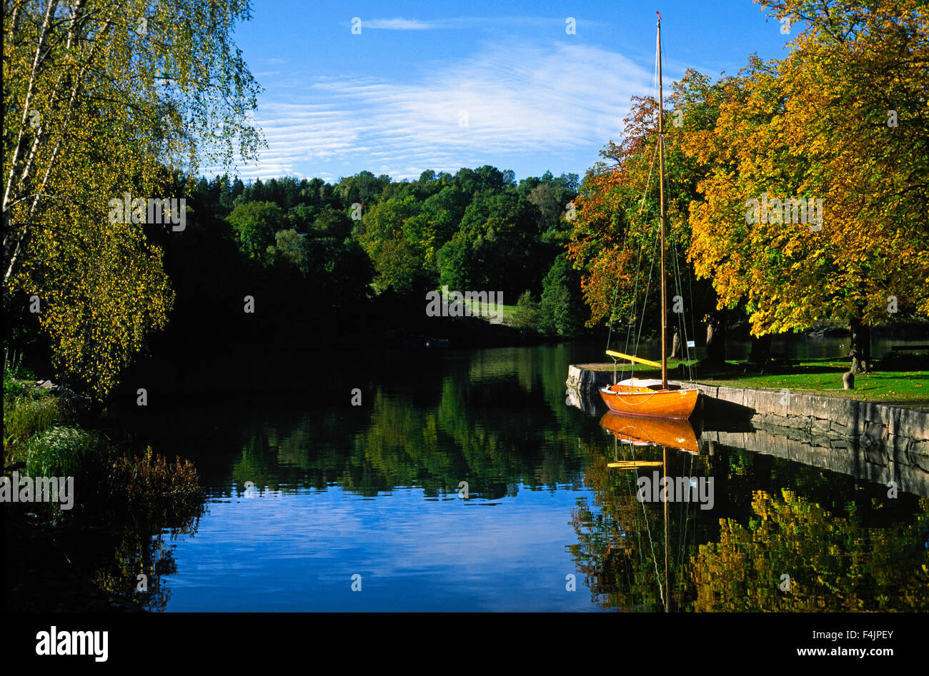 Small boat on river Stock Photo - Alamy