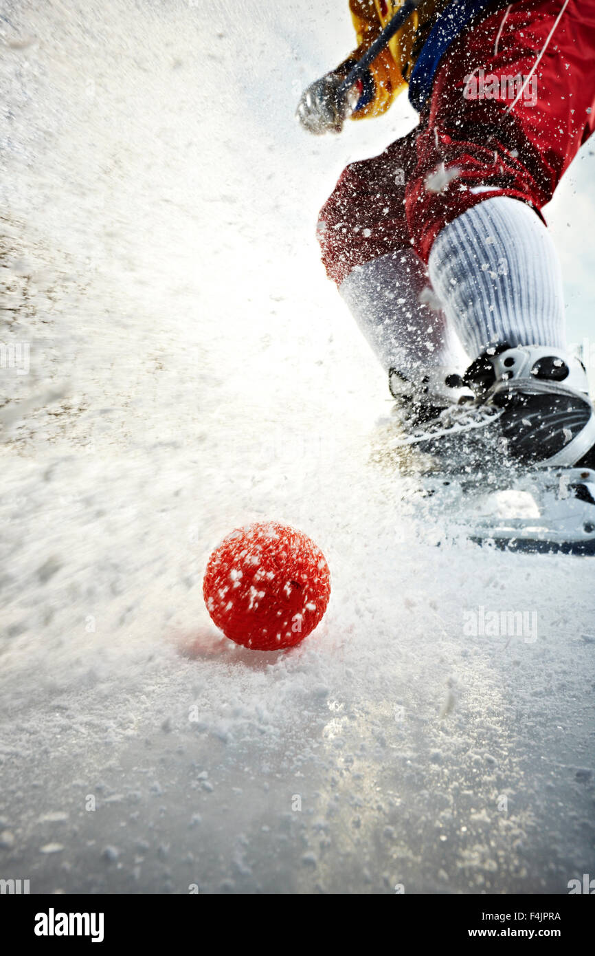 Man playing bandy Stock Photo - Alamy