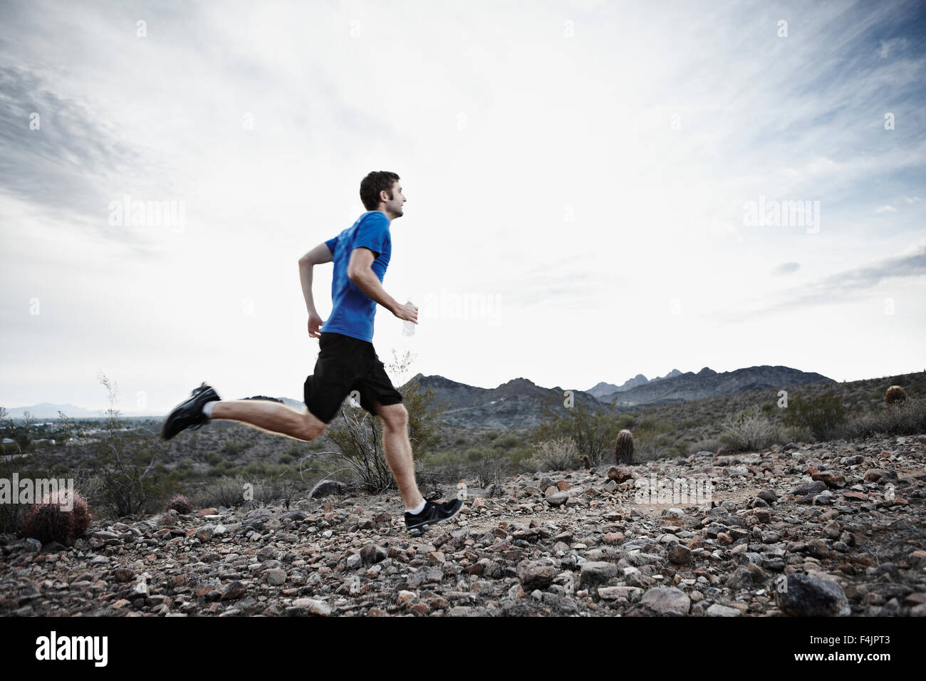 Man running mountain trail hi-res stock photography and images - Alamy