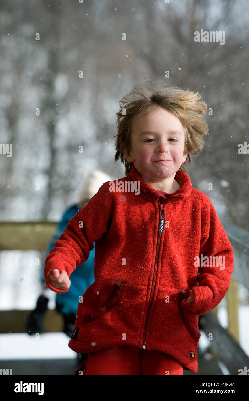 Boy running in balcony of house Stock Photo - Alamy