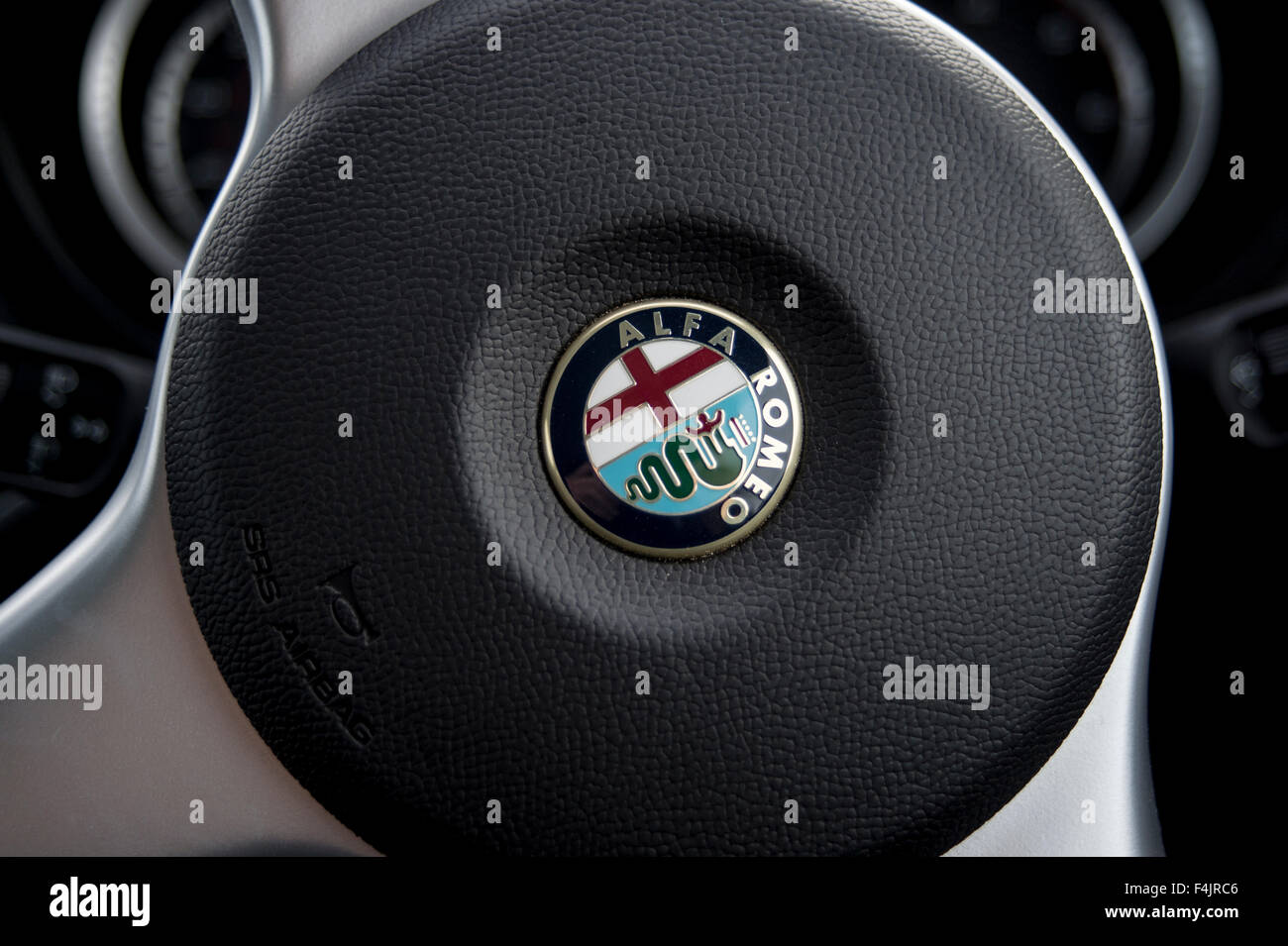 Alfa Romeo badge on the steering wheel of a Brera Stock Photo - Alamy