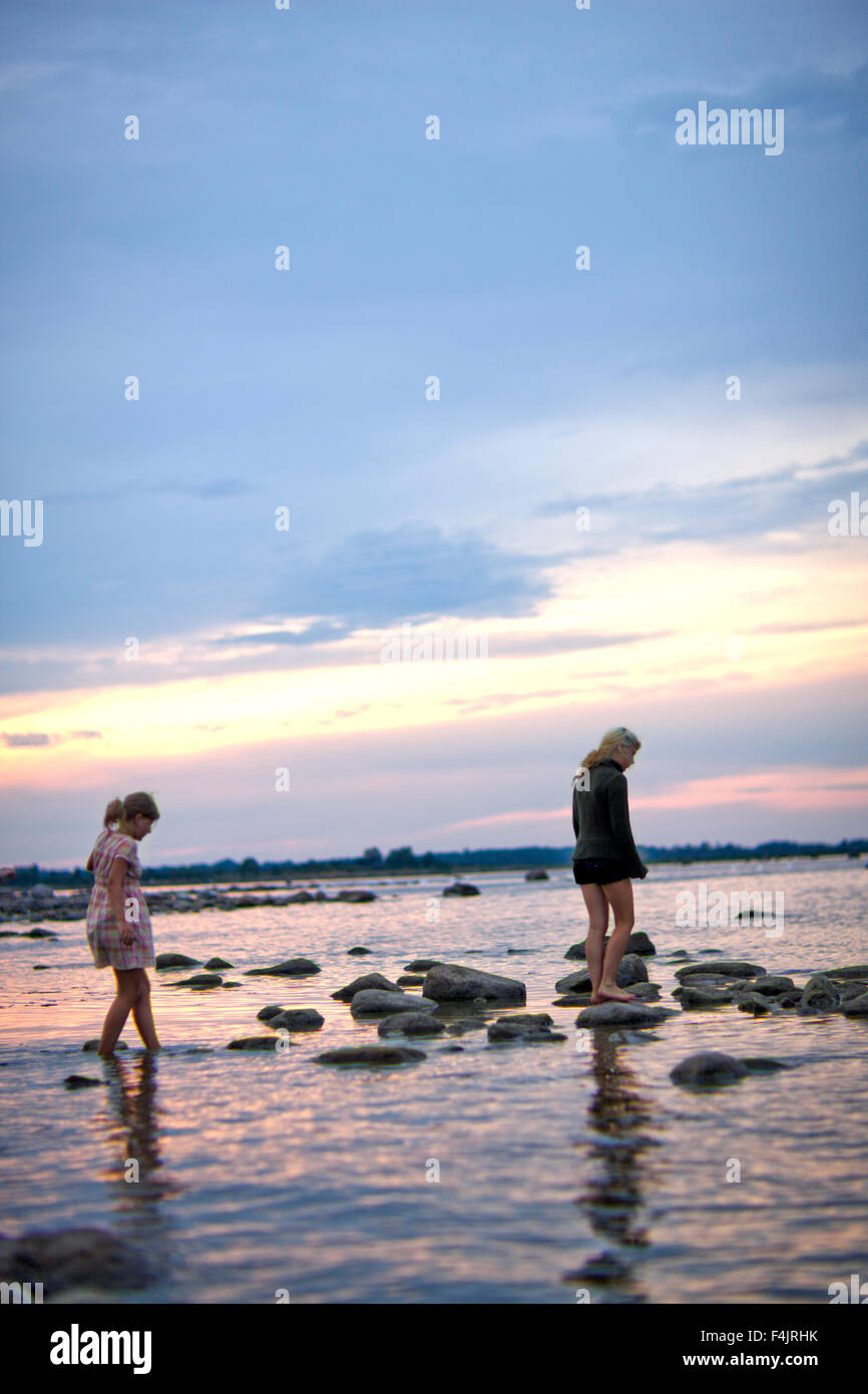 Two children playing on rocks hi-res stock photography and images - Alamy