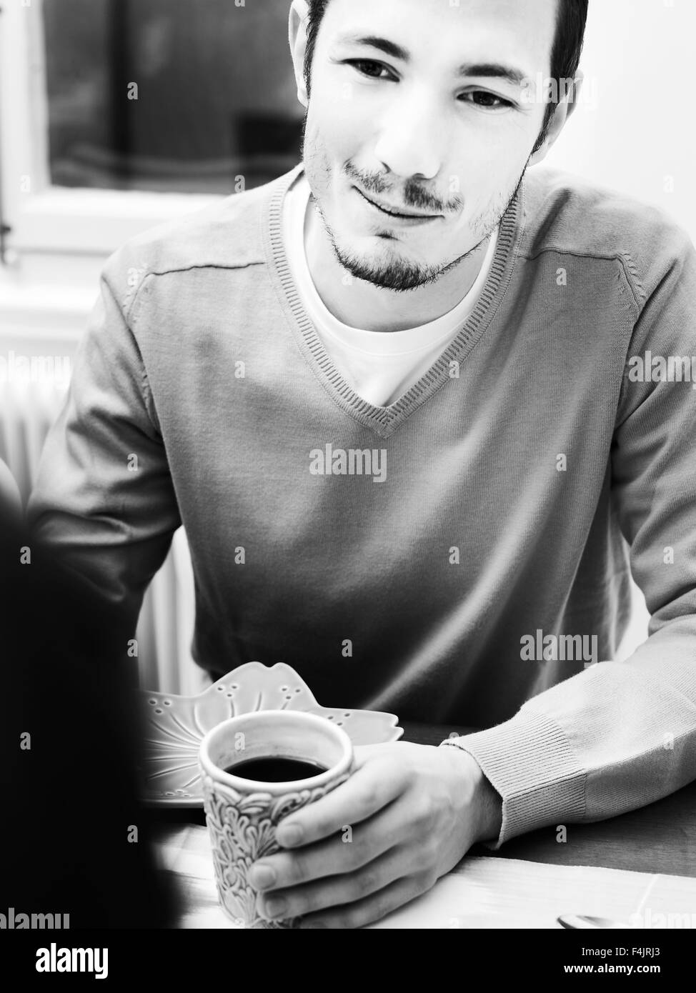 Man holding table Black and White Stock Photos & Images - Alamy