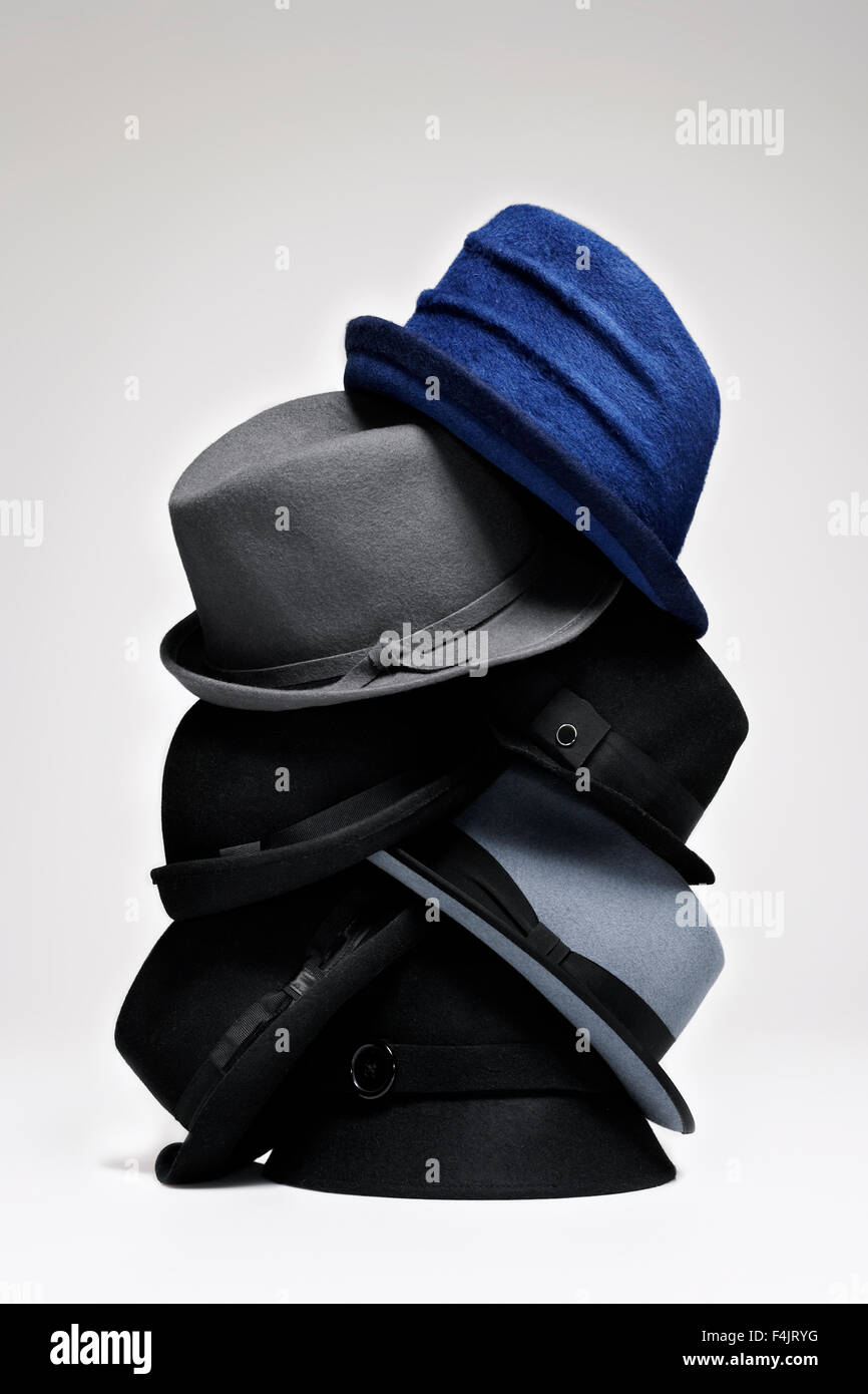 Stack of different hats against white background Stock Photo - Alamy
