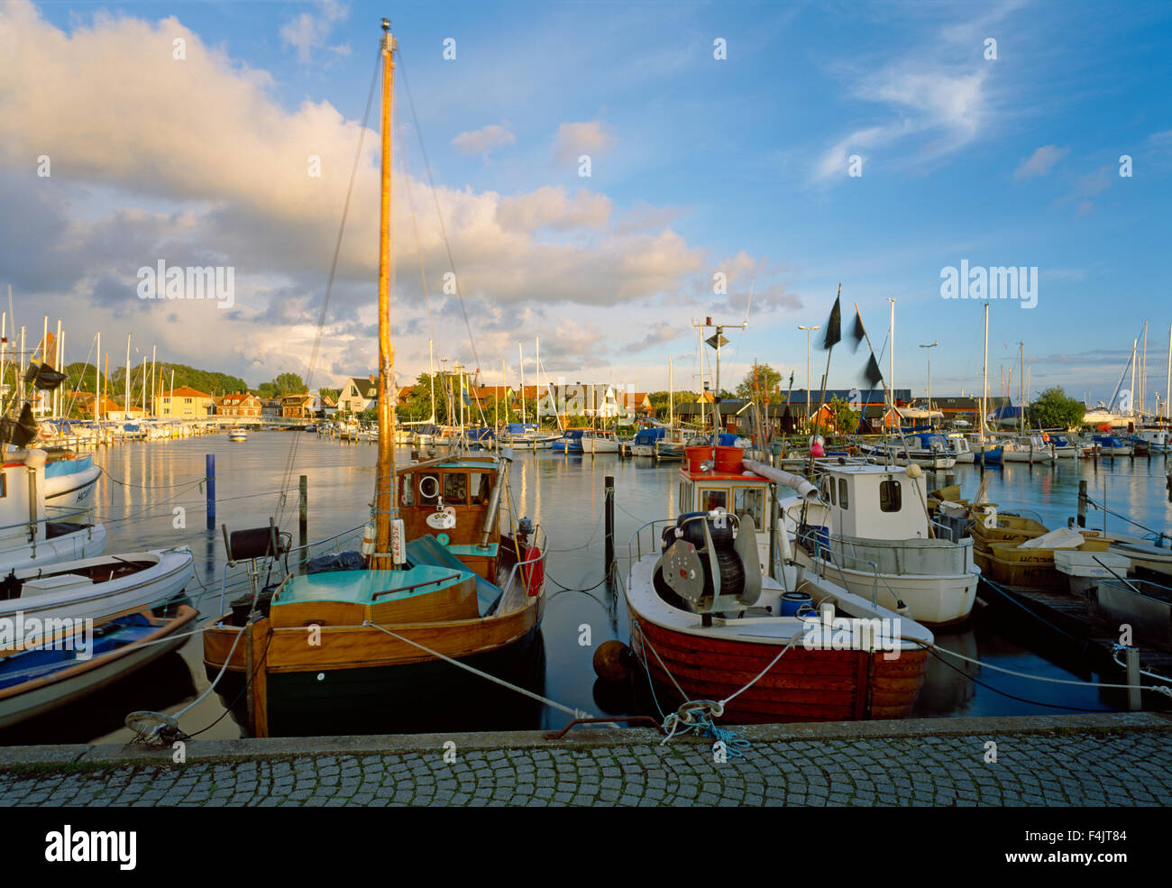 View of harbour with boats and city in background Stock Photo - Alamy