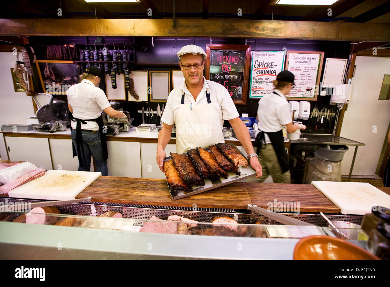 Man holding smoked meat Stock Photo - Alamy