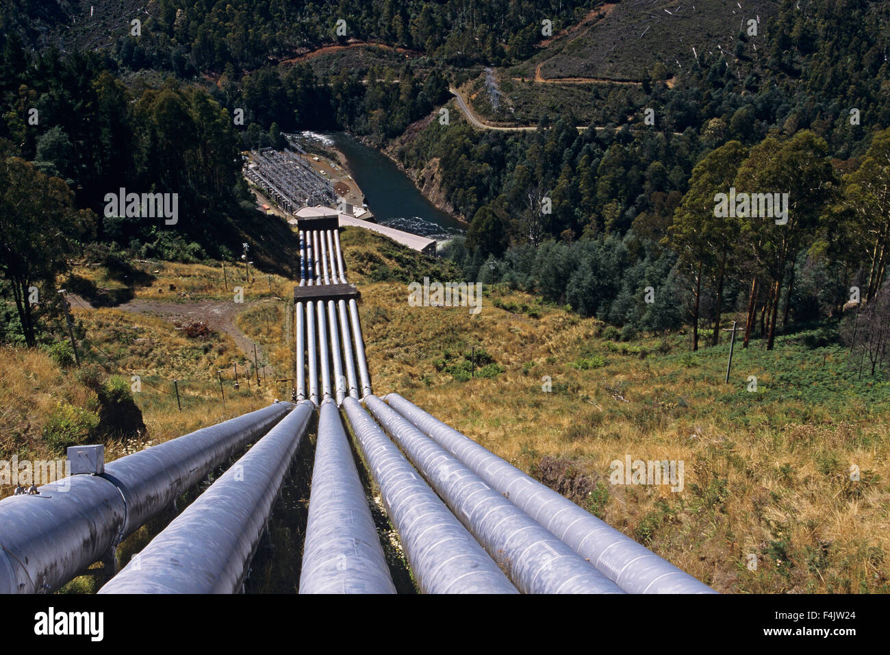 Pipeline running down hill Stock Photo - Alamy