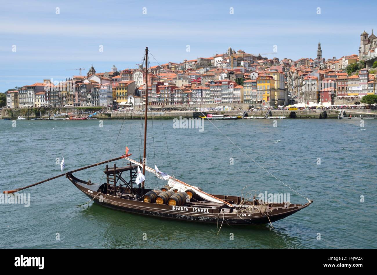 Rabelo boat, used to transport Port Wine, on the Douro river with views ...