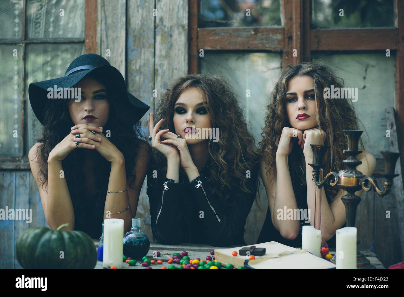 three witches at the table Stock Photo - Alamy