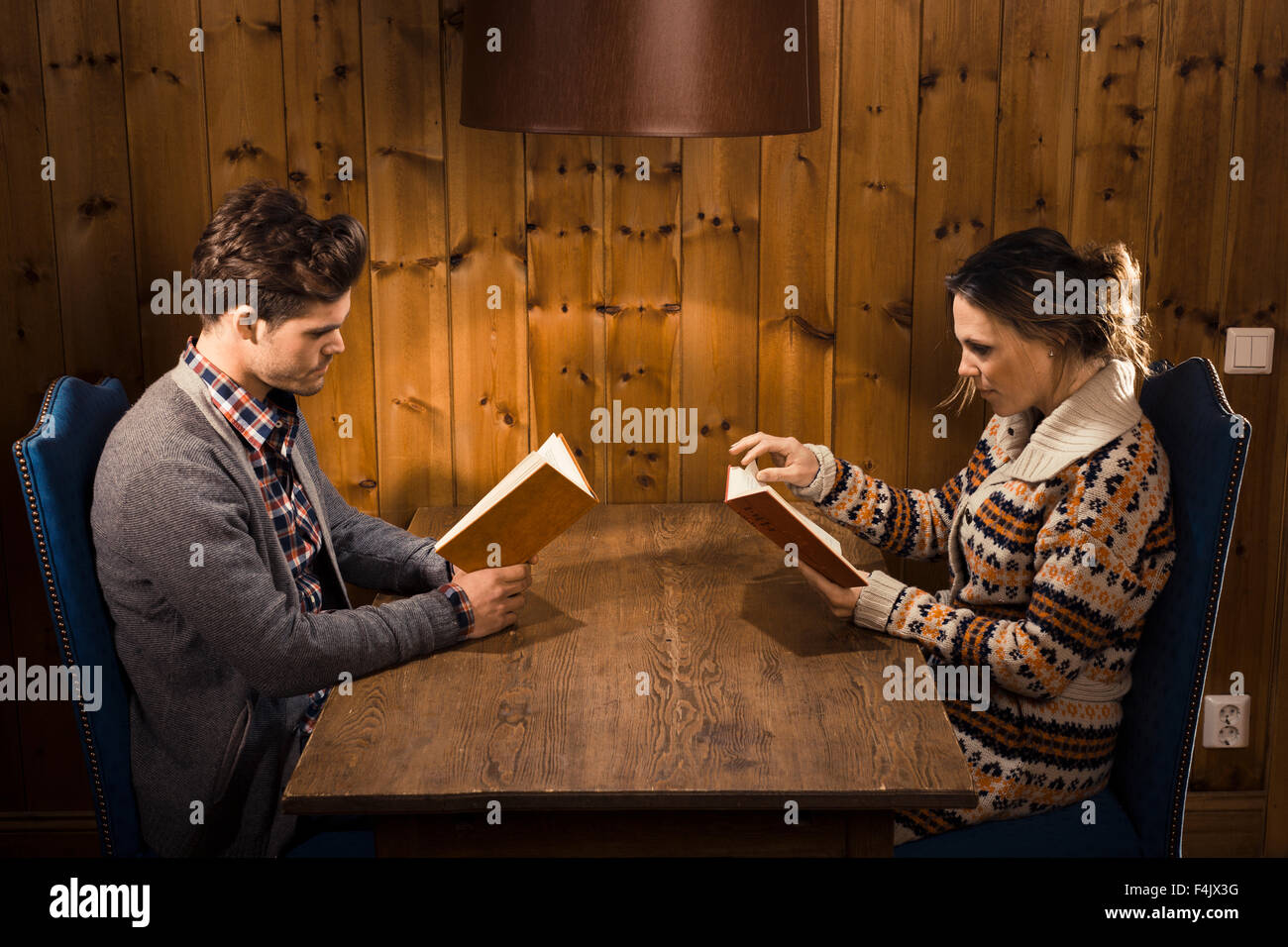 Reading the same book hi-res stock photography and images - Alamy