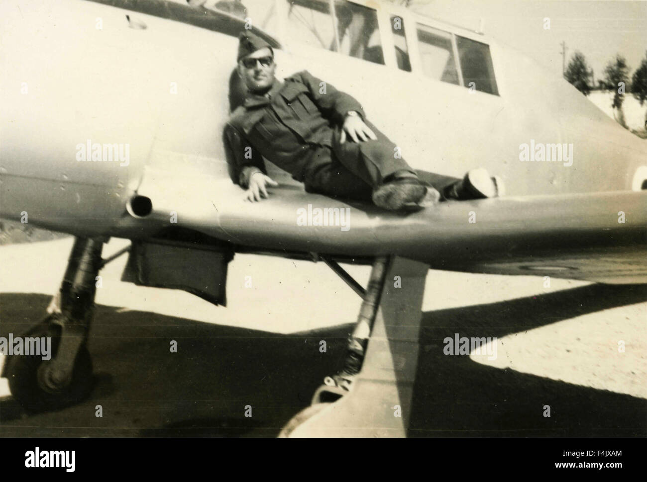 Soldier sitting on a plane, Italy Stock Photo - Alamy