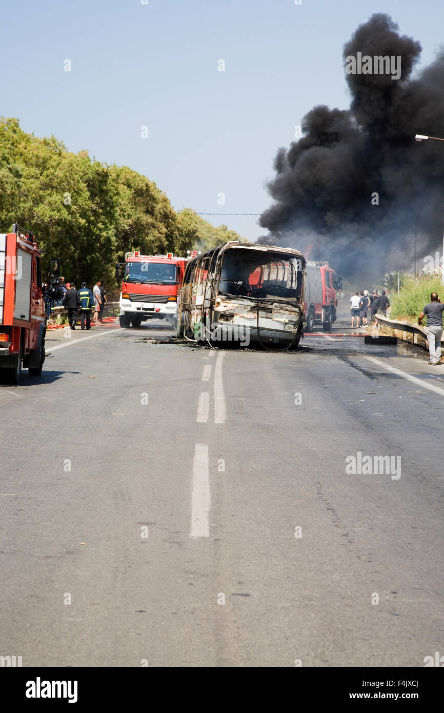 Bus burning in middle of highway Stock Photo - Alamy